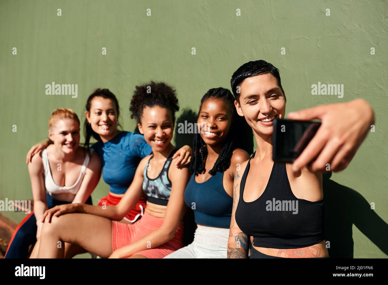 A post-game selfie for social media. Cropped shot of a diverse group of ...