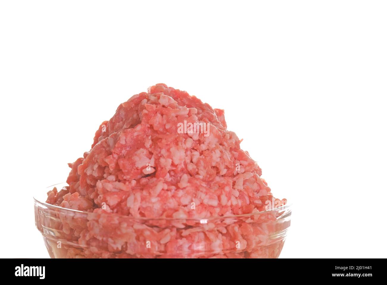 minced pork. fresh raw minced meat close-up in a transparent cup ...