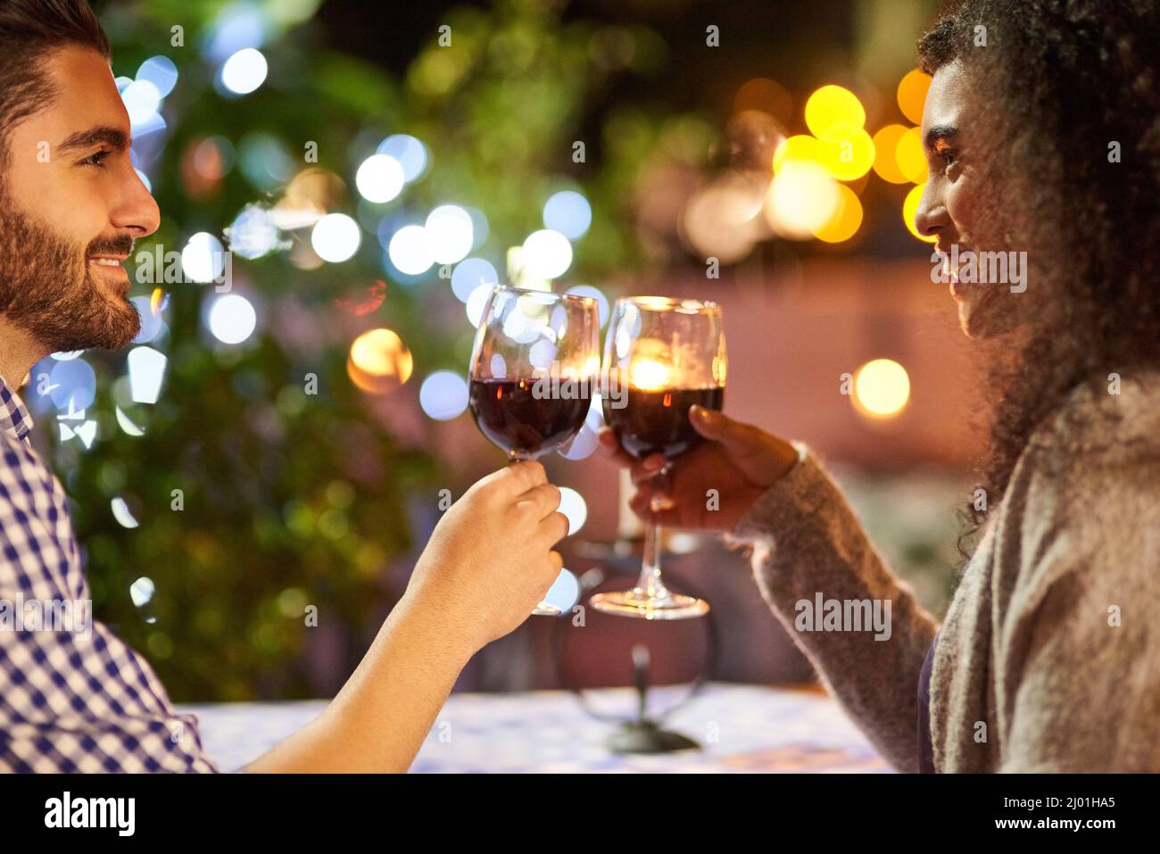 Lets toast to many more dates ahead.... Cropped shot of a young couple ...