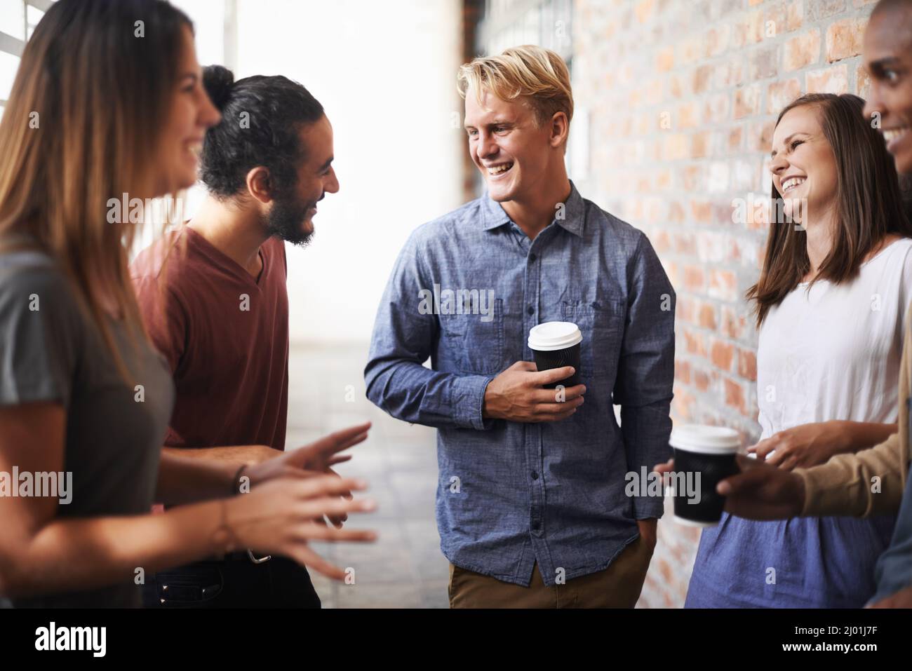Enjoying a conversation with collegues. Shot of a diverse group of ...