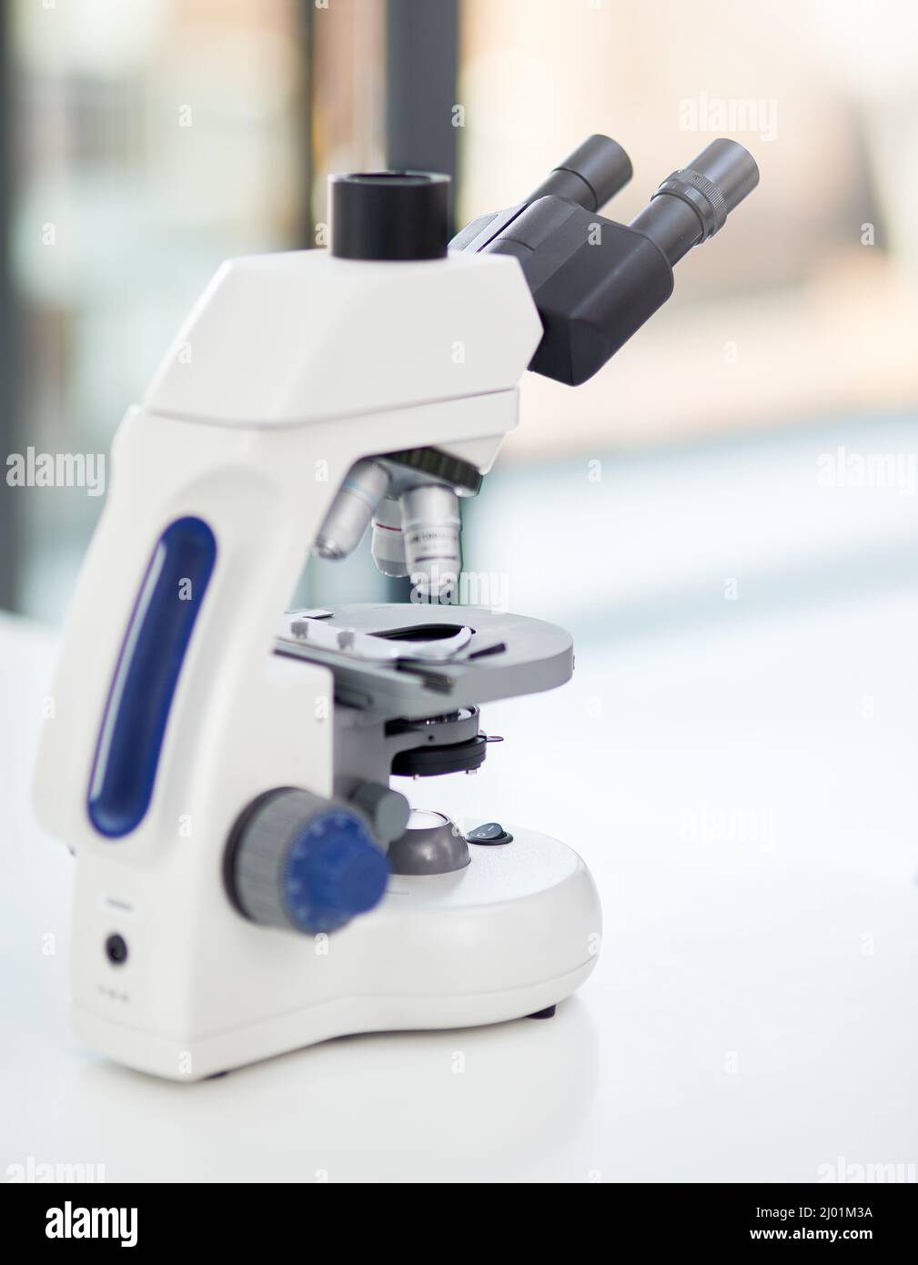 Take a closer look. Shot of a microscope in an empty laboratory Stock ...