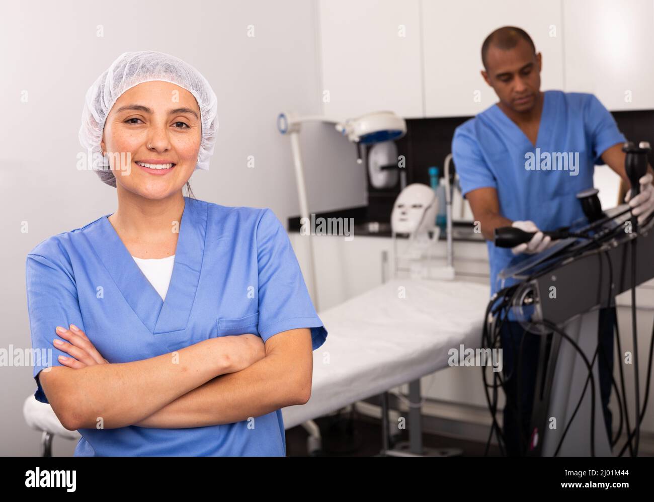 Smiling woman professional beautician in aesthetic cosmetology office ...