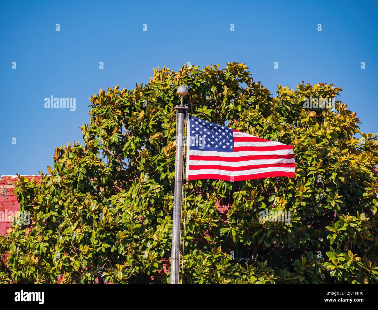 Flag swinging in the wind hi-res stock photography and images - Alamy