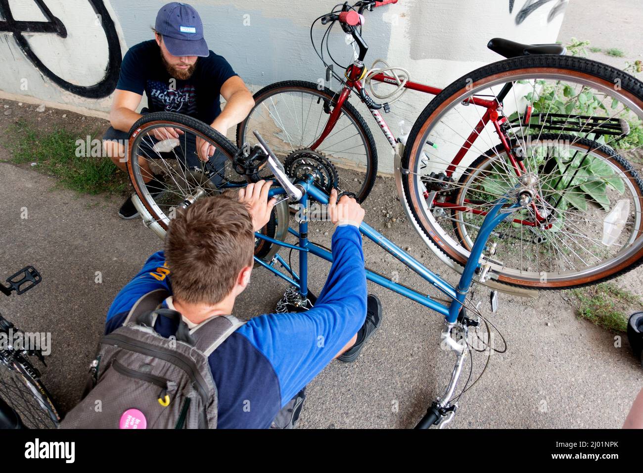Taking a break to repair a tire on the Midtown Greenway bicycle trail ...