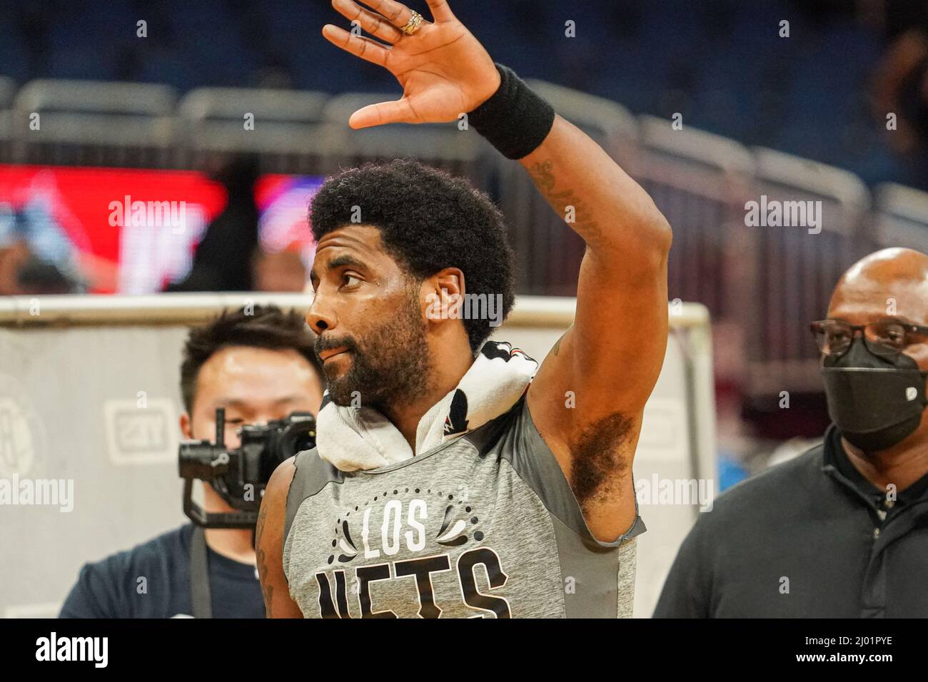 Orlando, Florida, USA, March 15, 2022, Point Guard Kyrie Irving #11 waves to fan after making a ...