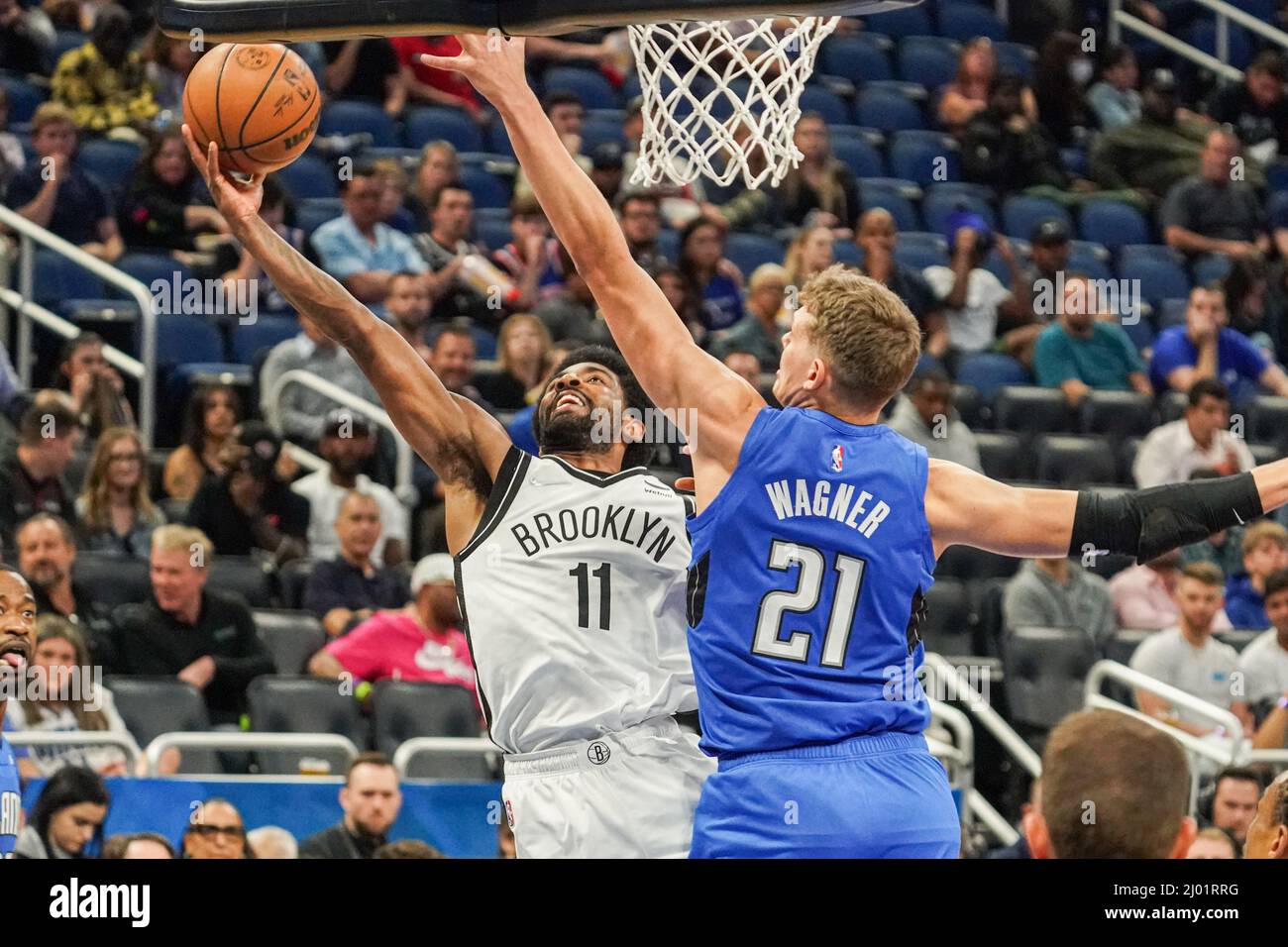 Orlando, Florida, USA, March 15, 2022, Brooklyn Nets Point Guard Kyrie Irving #11 attempt to ...