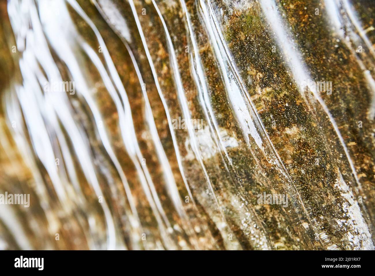 Winter rock wall covered in smooth wavy ice Stock Photo - Alamy
