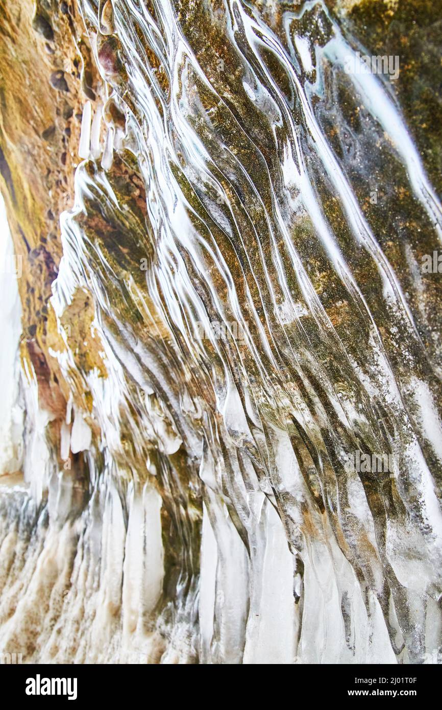 Small ripples of smooth ice on rock wall Stock Photo - Alamy
