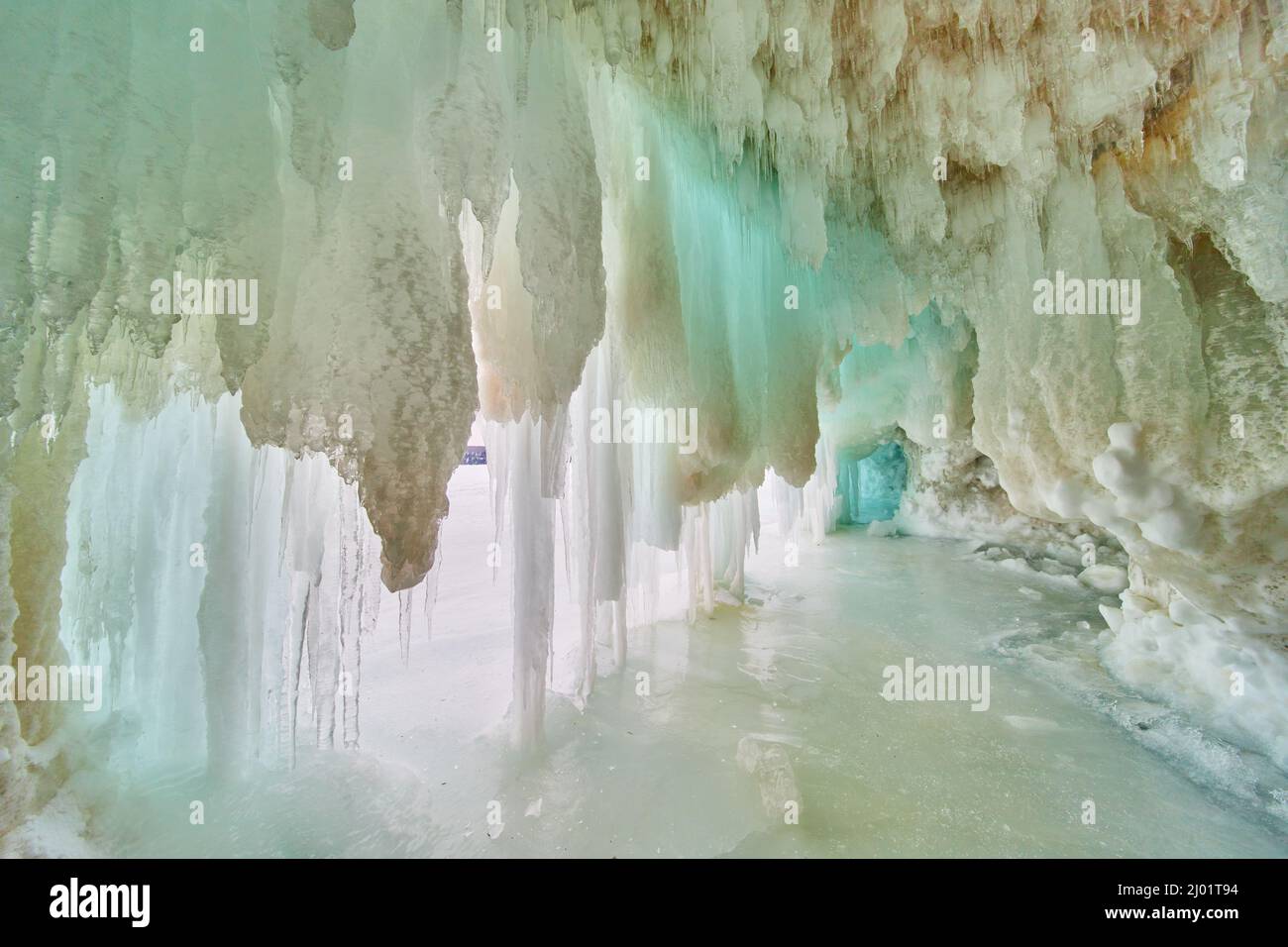 Small cavern made of ice and blue icicles Stock Photo - Alamy