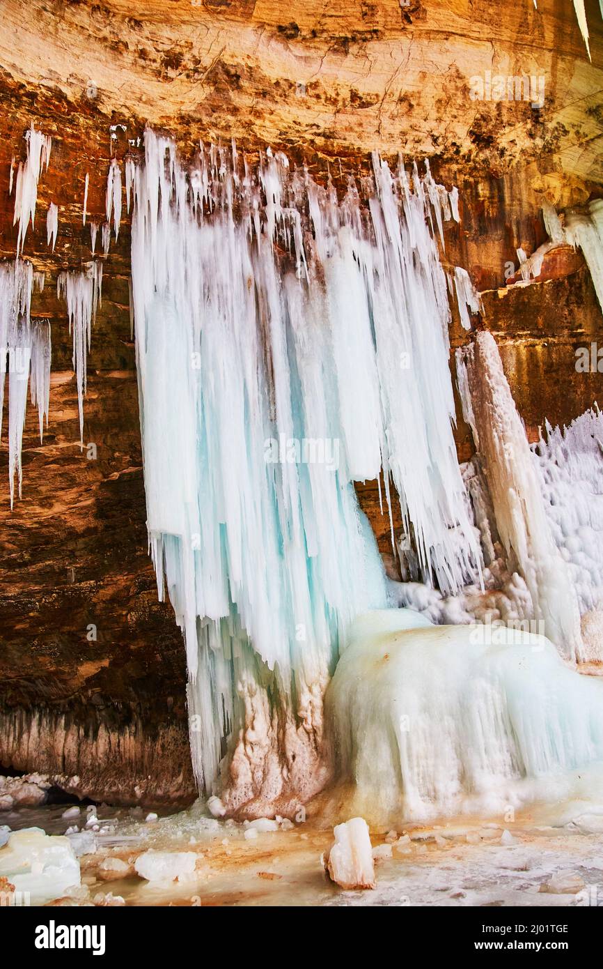Blue ice formations and icicles on wall of rock Stock Photo - Alamy