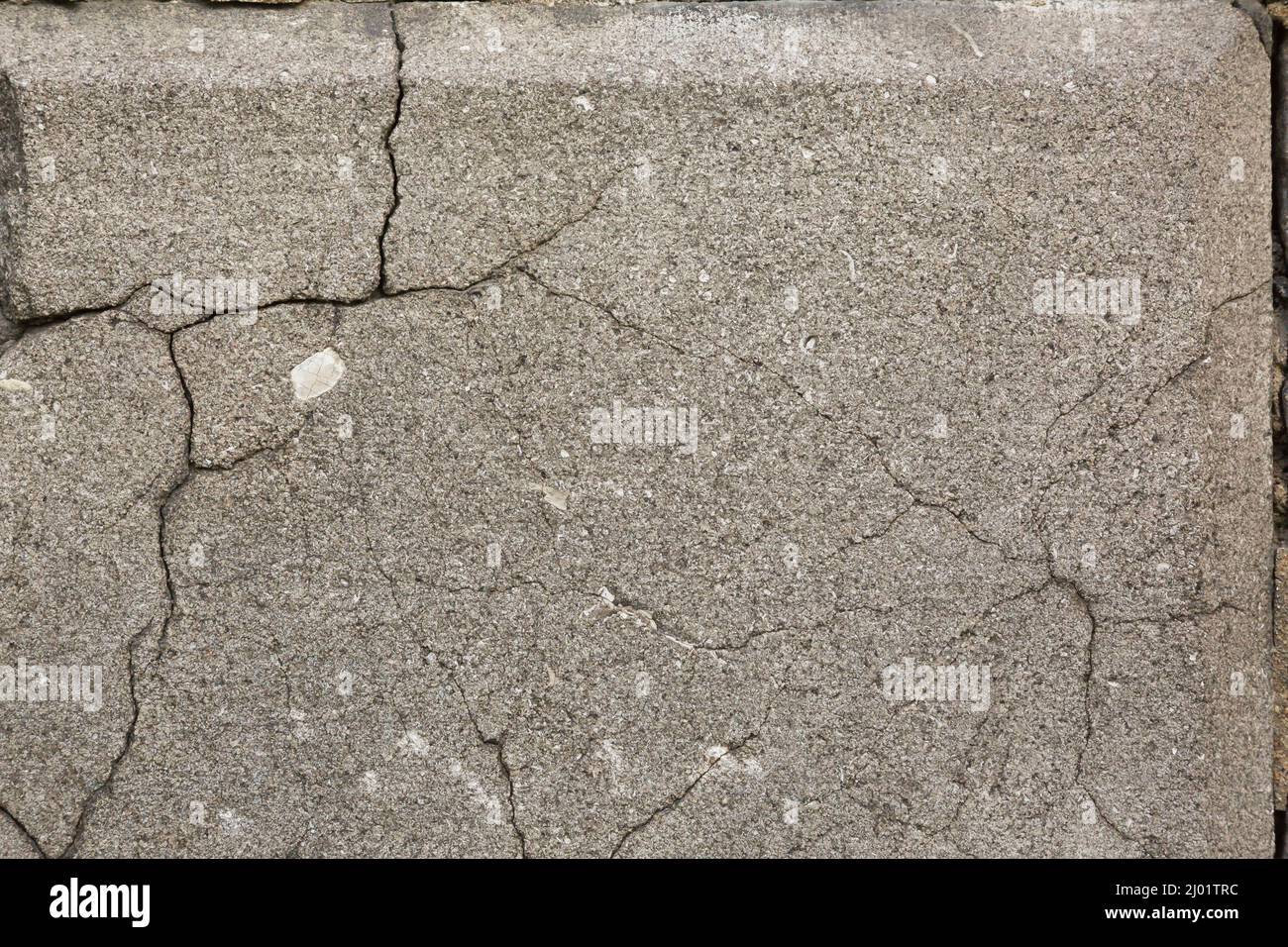 Close-up of cracks in grey granite stone foundation wall Stock Photo ...