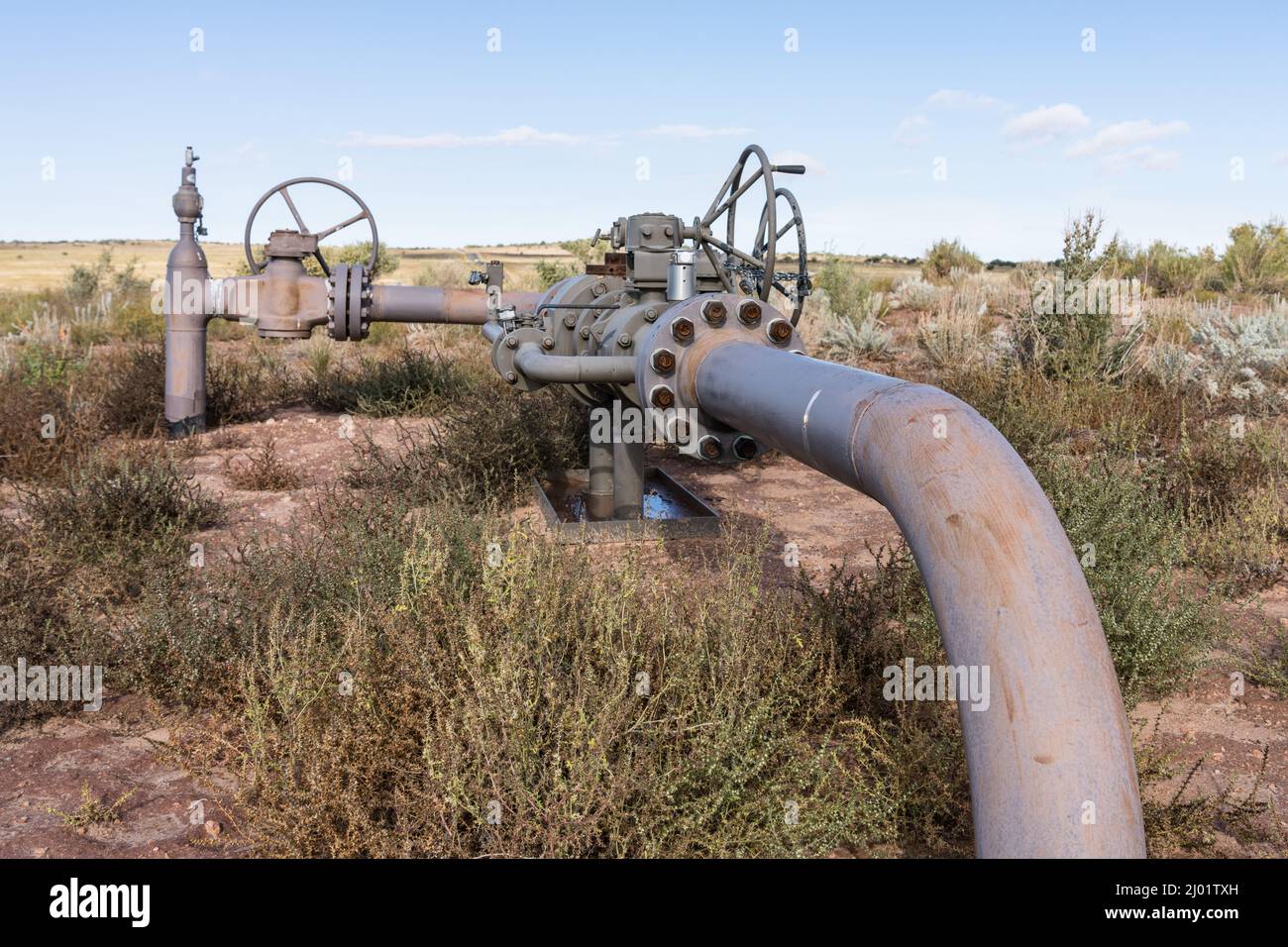 Crude oil collection pipeline in an oil field Stock Photo - Alamy