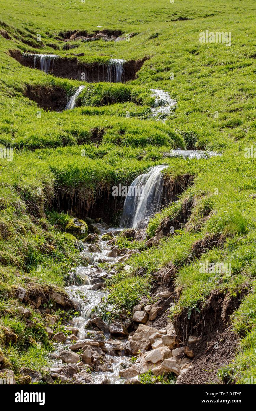 Stream in a cracked area causing erosion after heavy rain Stock Photo ...