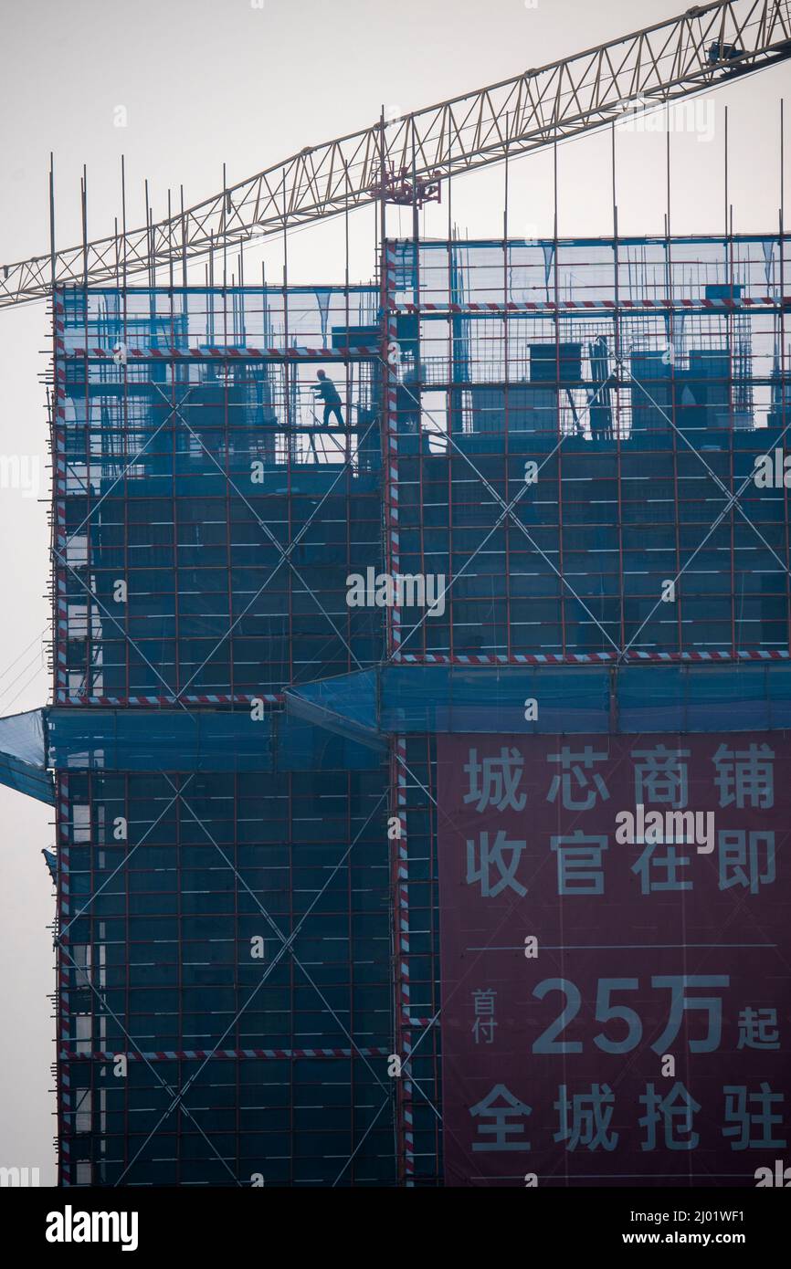 HAIAN, CHINA - MARCH 16, 2022 - Construction workers work at a property ...