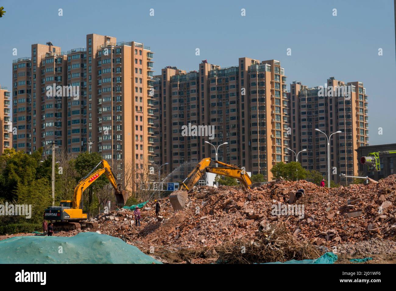 HAIAN, CHINA - MARCH 9, 2022 - Workers operate construction machinery ...