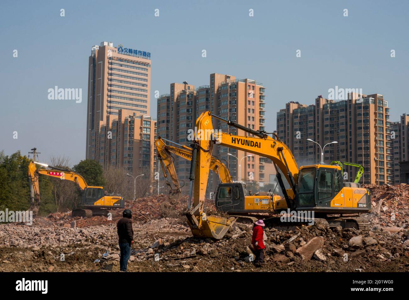 HAIAN, CHINA - MARCH 9, 2022 - Workers operate construction machinery ...