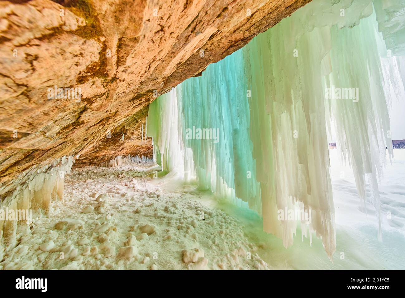 Frozen waterfall from inside ice cavern Stock Photo - Alamy