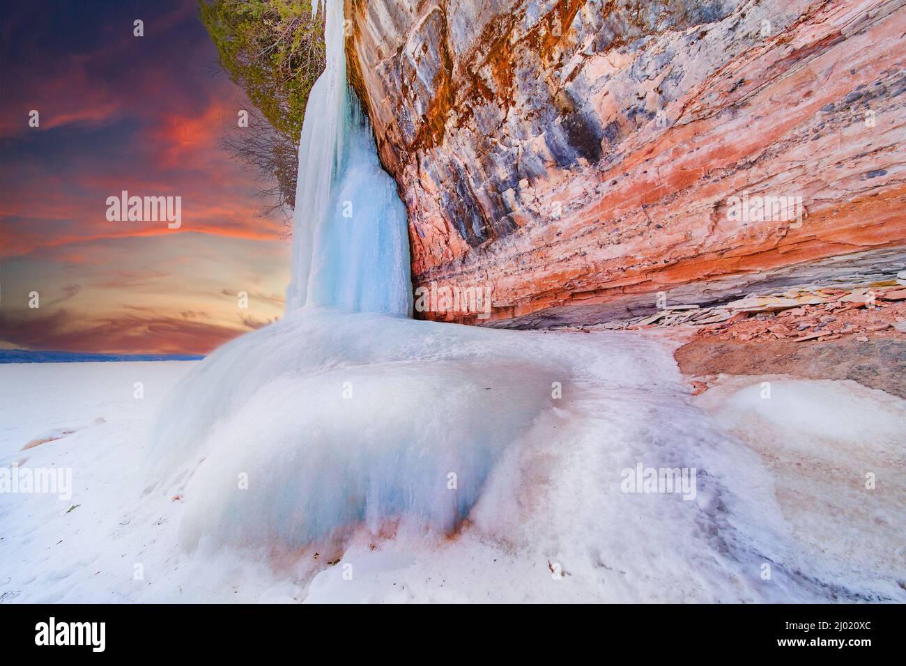 Stunning colorful cliffs with ice formations during sunrise Stock Photo ...