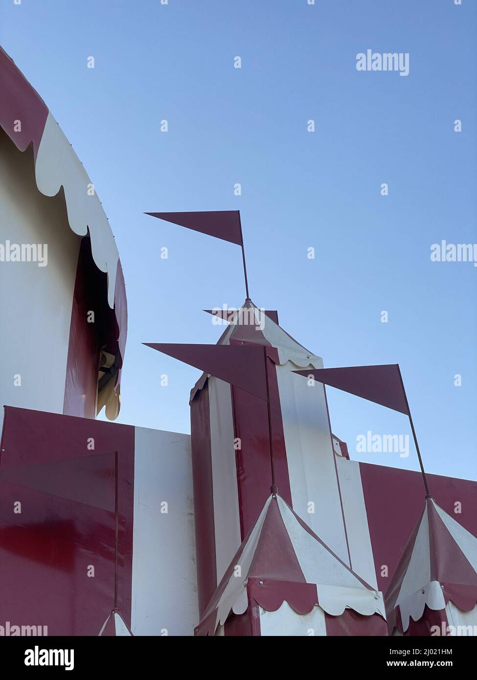 Vertical shot of a portable circus building on blue sky background ...