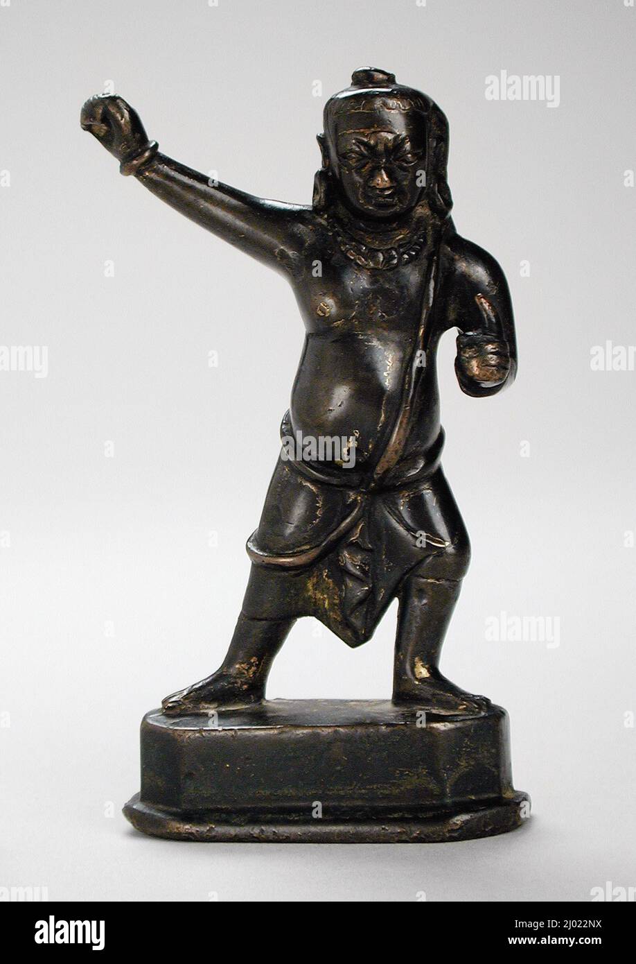 The God Achala. Nepal, 10th century. Sculpture. Brass with paint Stock ...