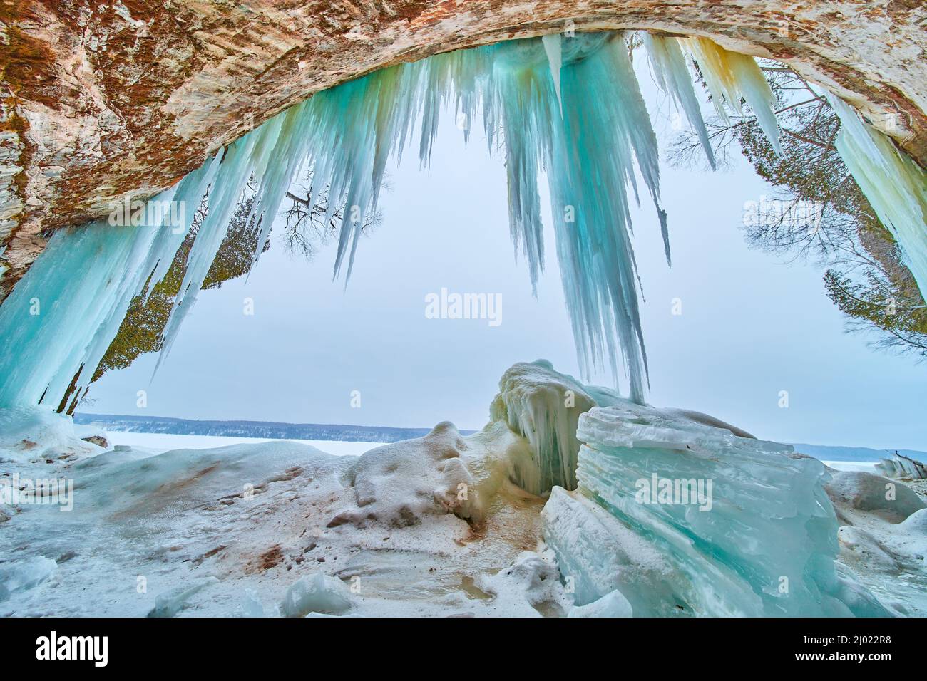 Large chunks of broken icicles at entrance to ice cave with hanging ...