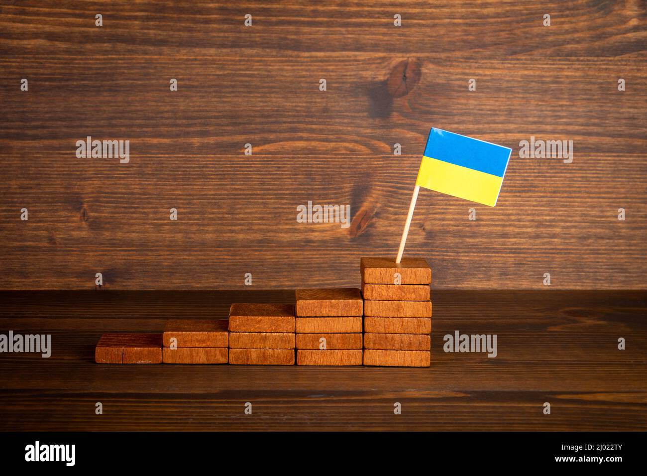 Ukrainian flag on wooden steps. Victory and development Stock Photo - Alamy