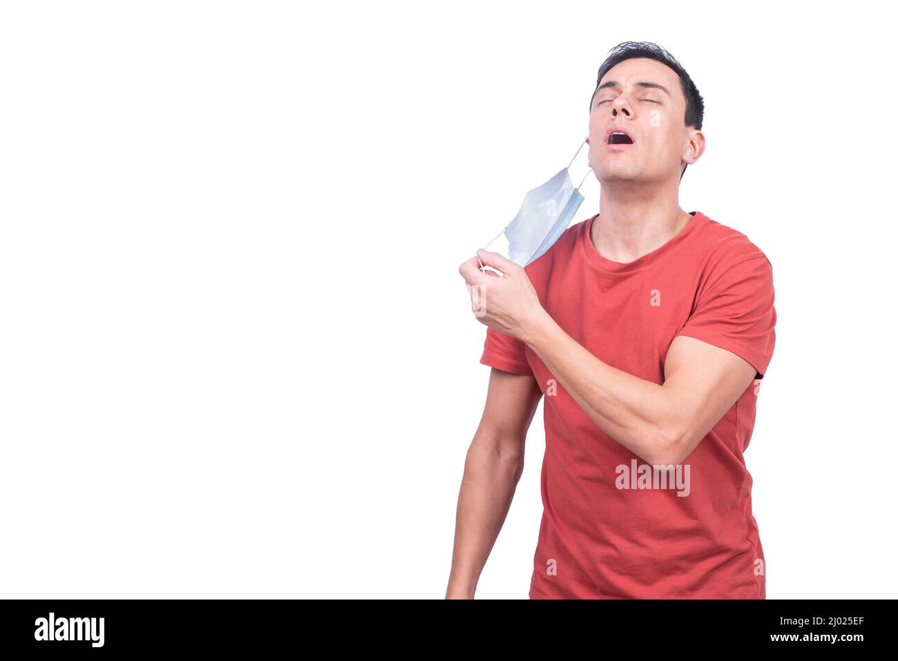 Man taking off medical mask during COVID pandemic Stock Photo - Alamy