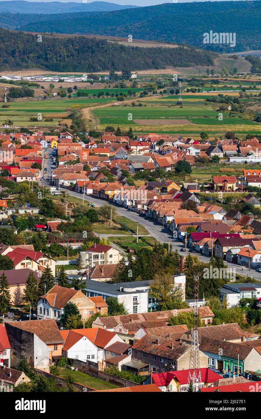 Aerial view of the town center with hills, buildings, streets ...