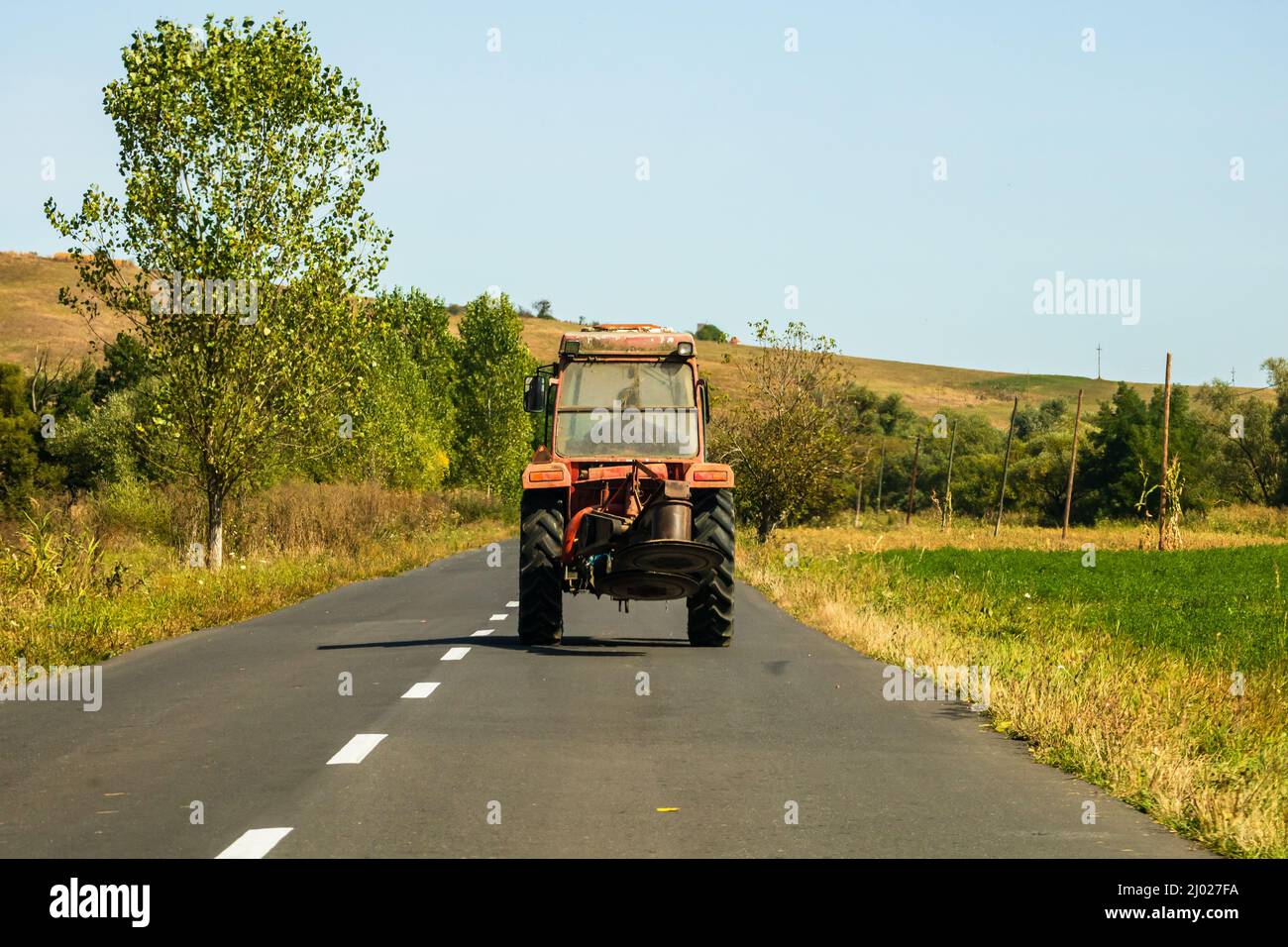 Agricultural tractor on road in Viscri, Romania, 2021 Stock Photo - Alamy