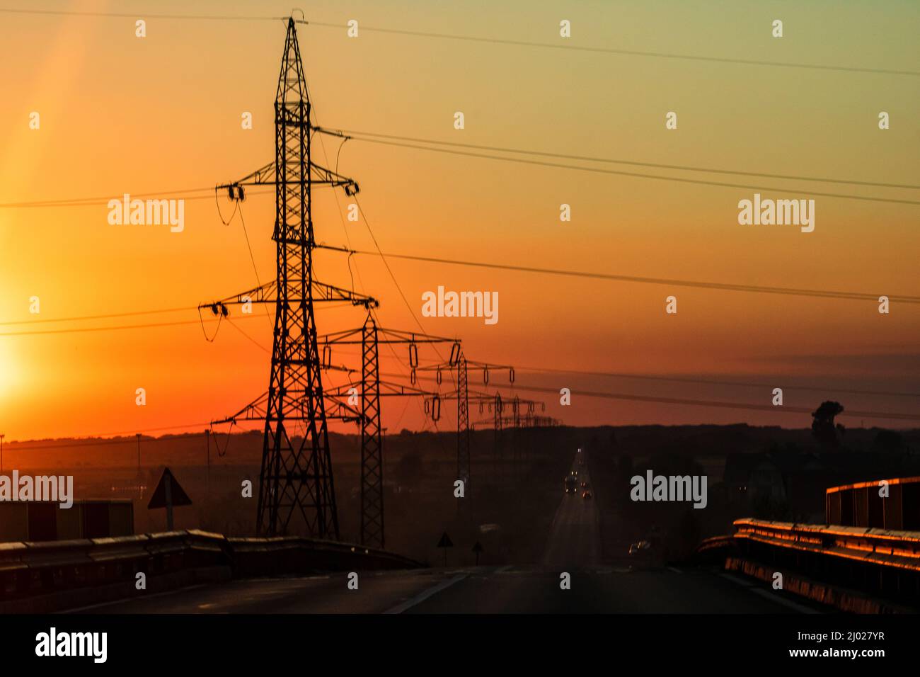 Electric power pylon, electric tower at sunset Stock Photo - Alamy