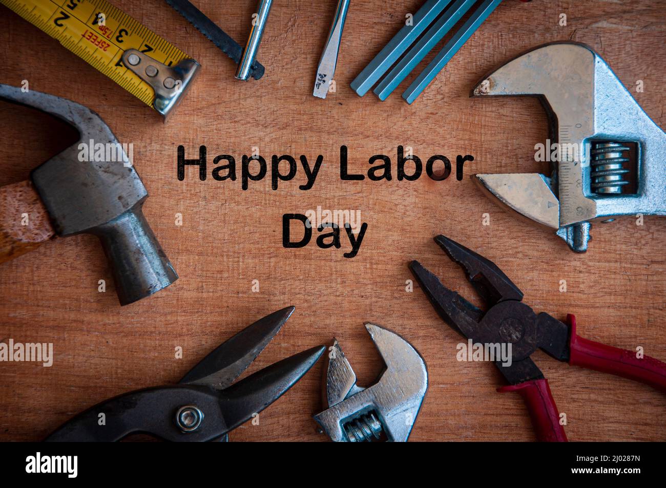 Text on wooden desk - Happy Labor Day with working tools background ...
