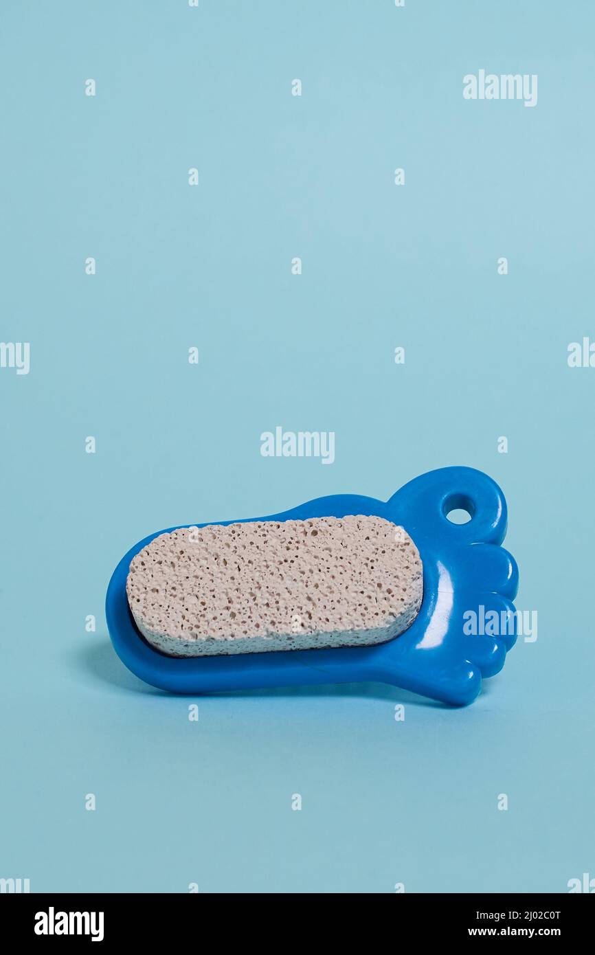 Pedicure kit. Pumice stone on a blue background Stock Photo - Alamy