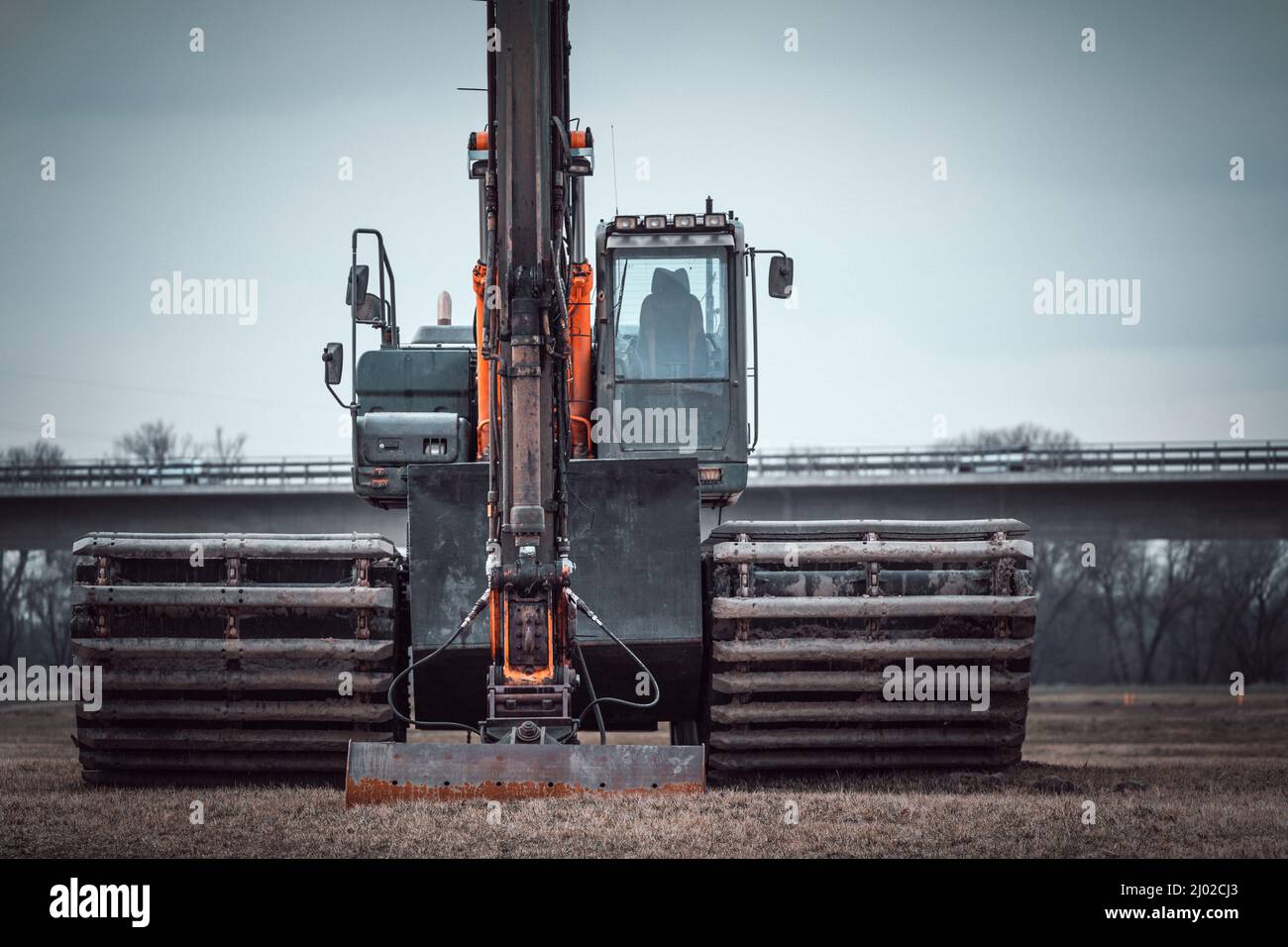 Excavator in a rural field Stock Photo - Alamy