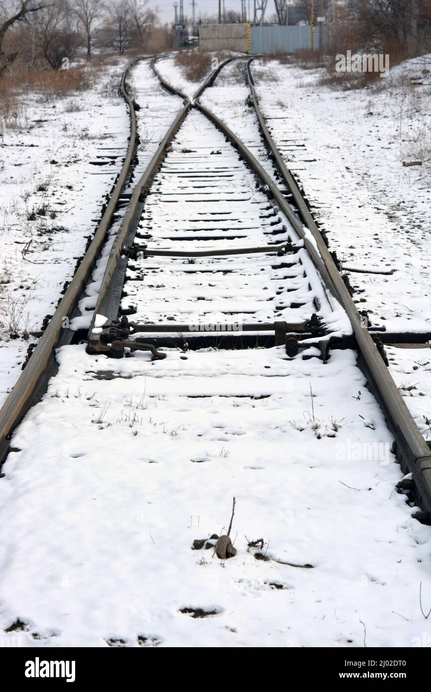 The railway track, large and heavy metal rails are located in one ...