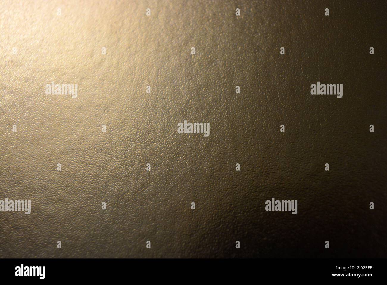Golden matte paper with a rough surface, gilding with a dark and golden ...