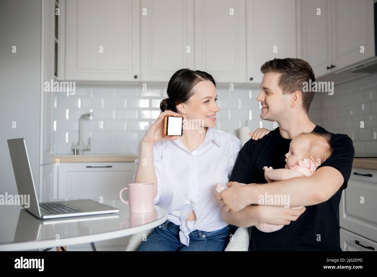 Happy family of influencers bloggers, young parents blogging about ...