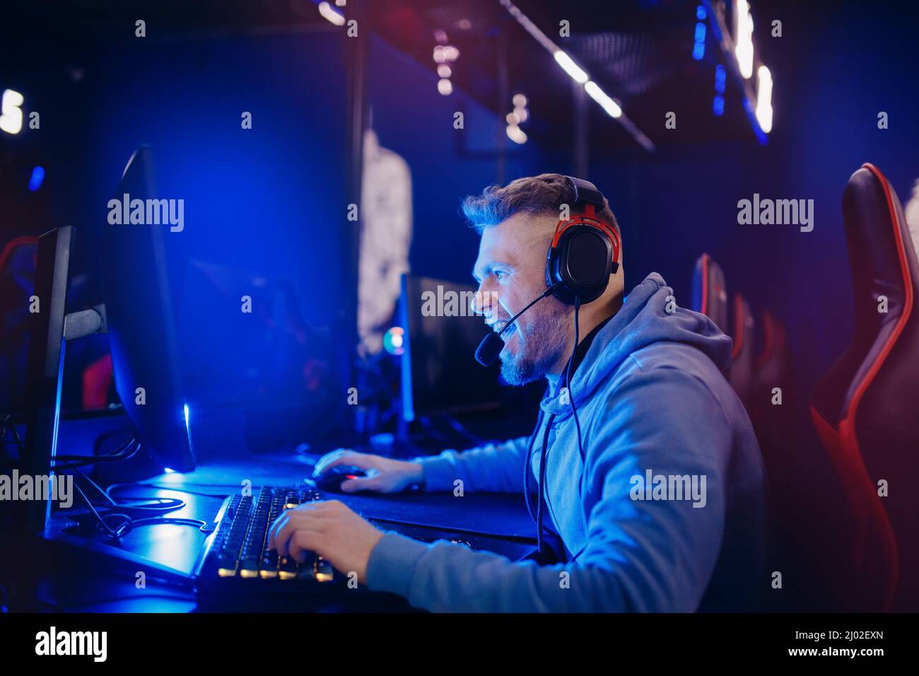 Streamer young man rejoices in victory professional gamer playing ...