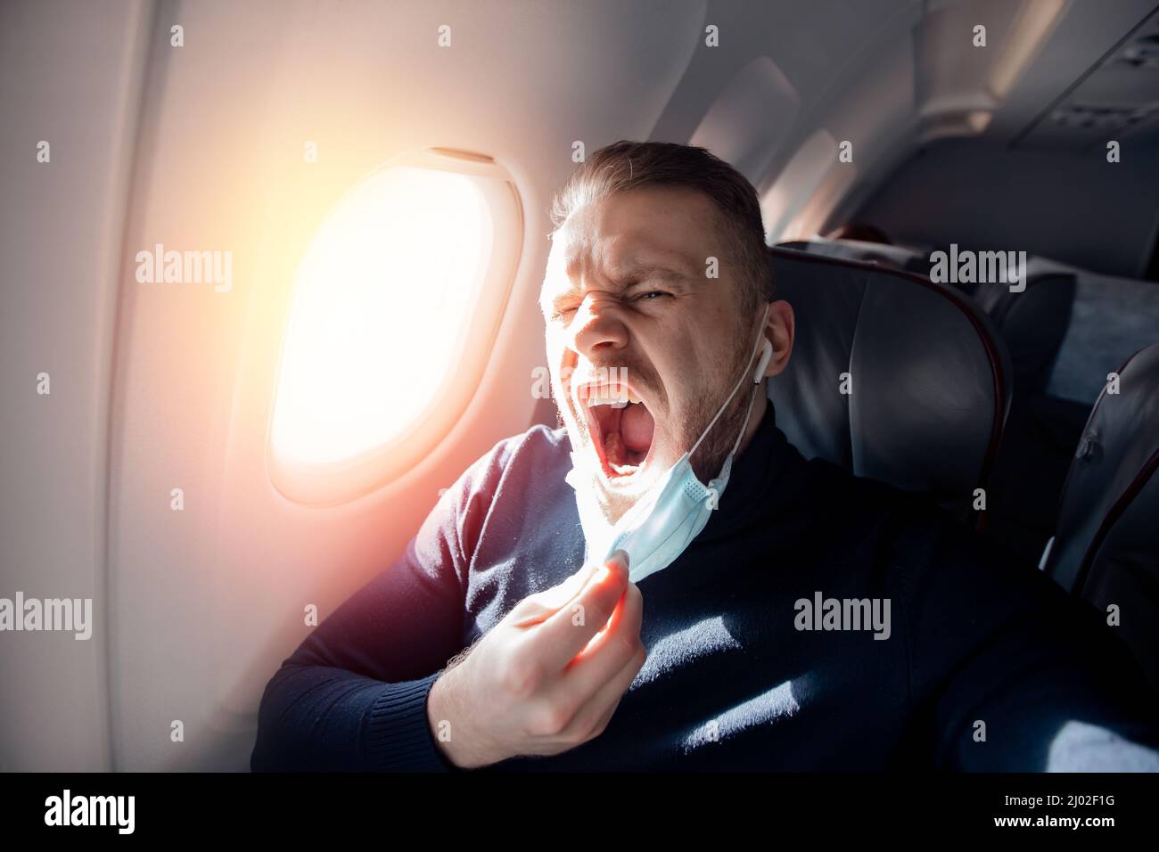 Afraid of fear flying on airplane and height tourist man in safe ...