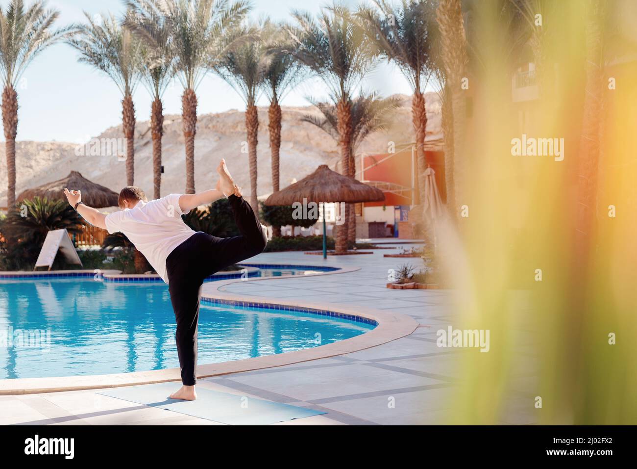 balance Asana standing on one leg, meditation yoga caucasian man in ...