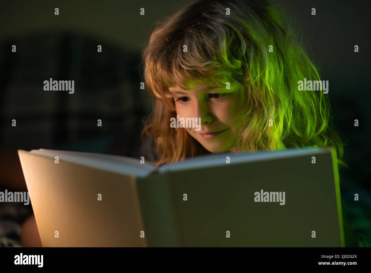 Child reading a books. Kids bedtime, boy reading a book in bed. Bedtime ...