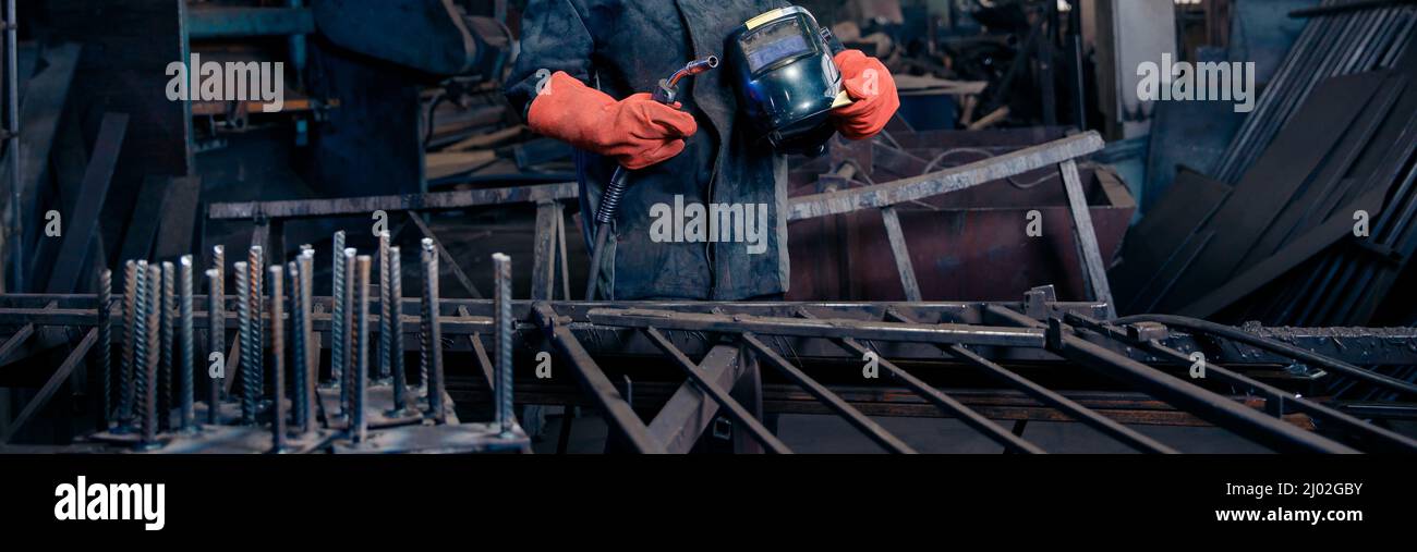 Banner factory worker industrial welder in protective uniform Stock ...