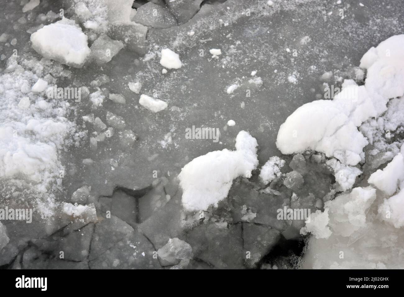 Beautiful and unusual backgrounds of nature, a thick layer of ice with ...