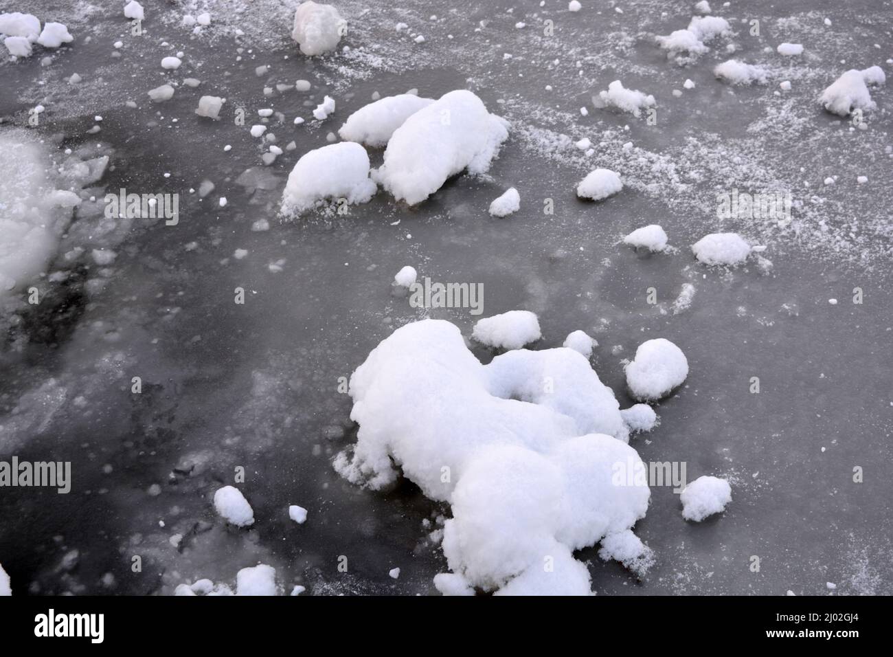 Beautiful and unusual backgrounds of nature, a thick layer of ice with ...