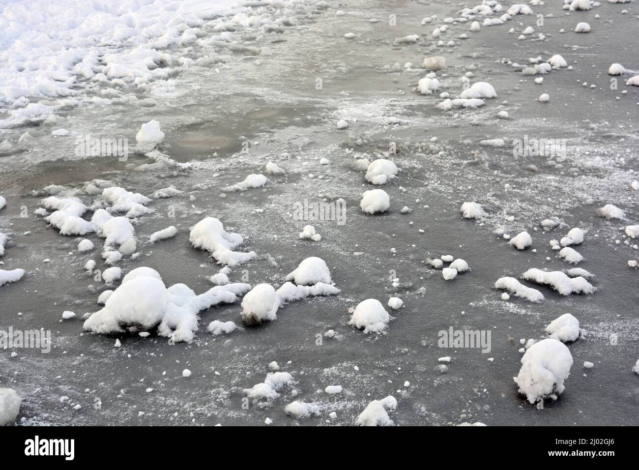Beautiful and unusual backgrounds of nature, a thick layer of ice with ...