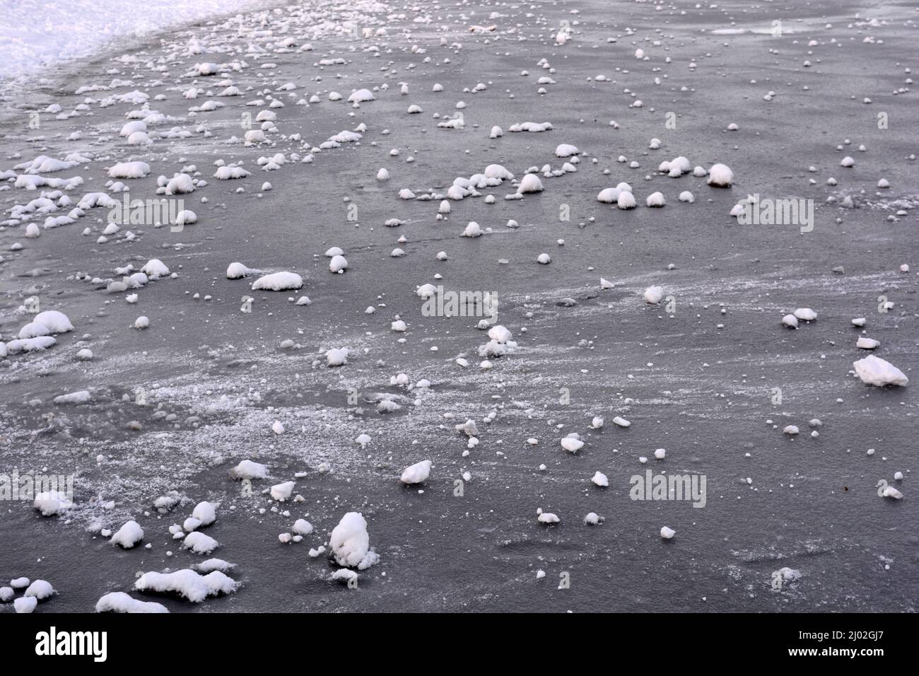 Beautiful and unusual backgrounds of nature, a thick layer of ice with ...