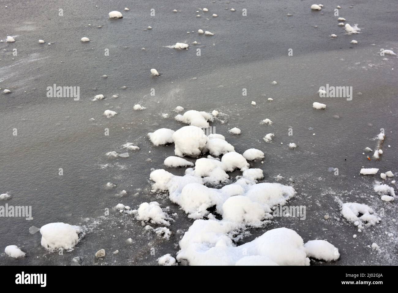 Beautiful and unusual backgrounds of nature, a thick layer of ice with ...