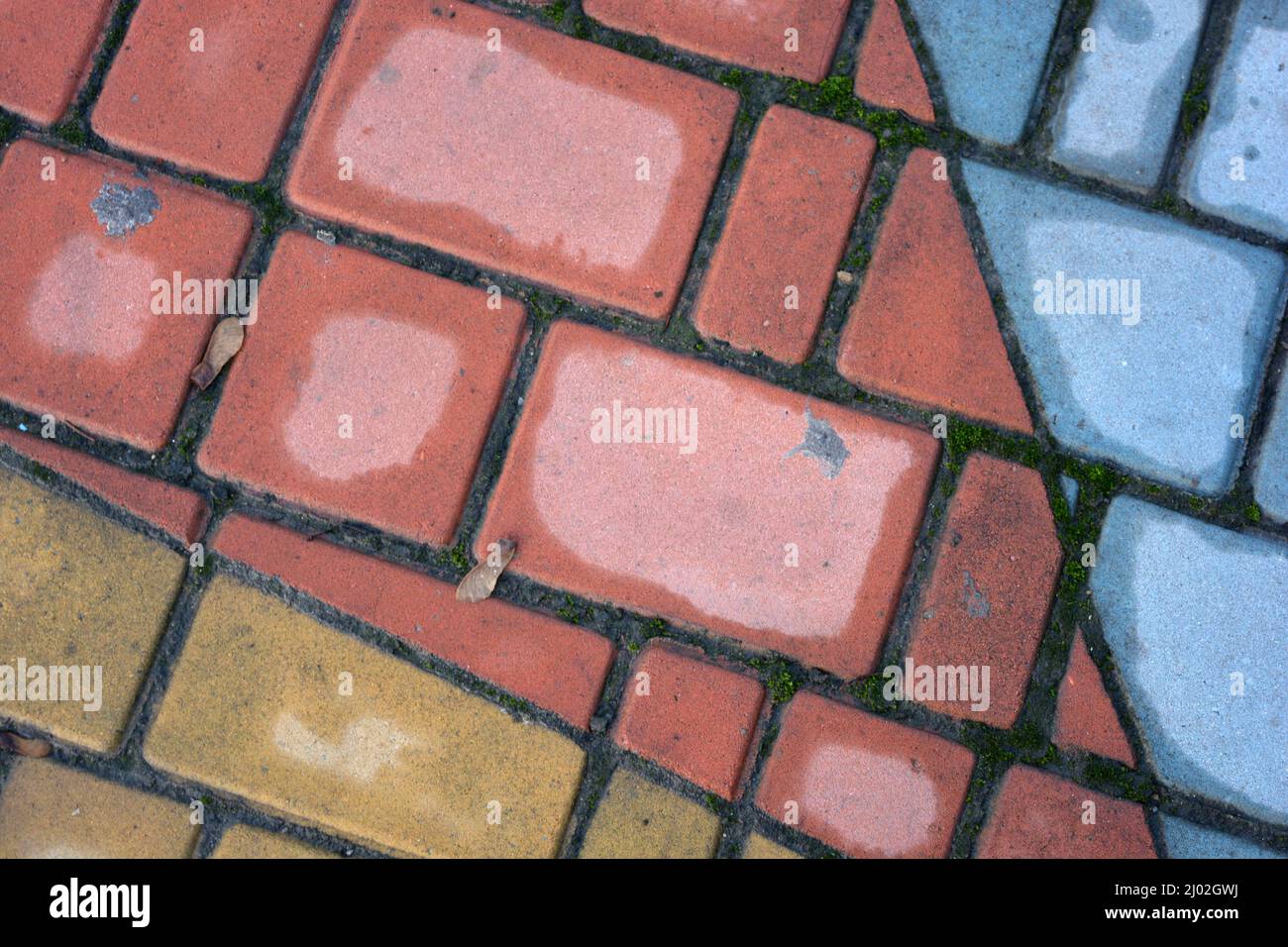Building materials, road surface, pavement made of colored stones blue ...