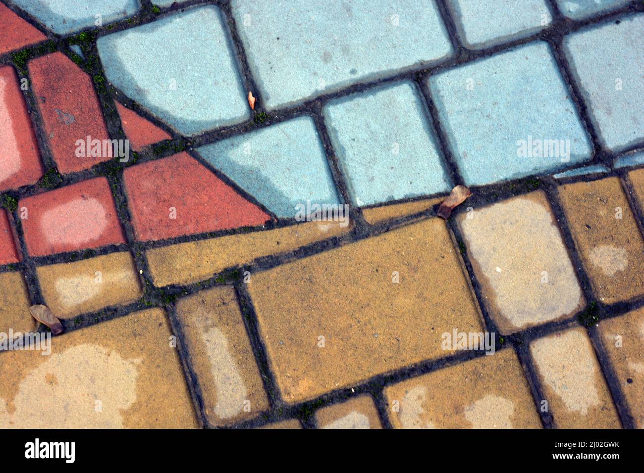 Building materials, road surface, pavement made of colored stones blue ...