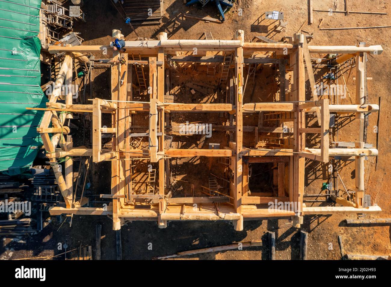Construction industry concept. Timber wooden frame of house from bar ...