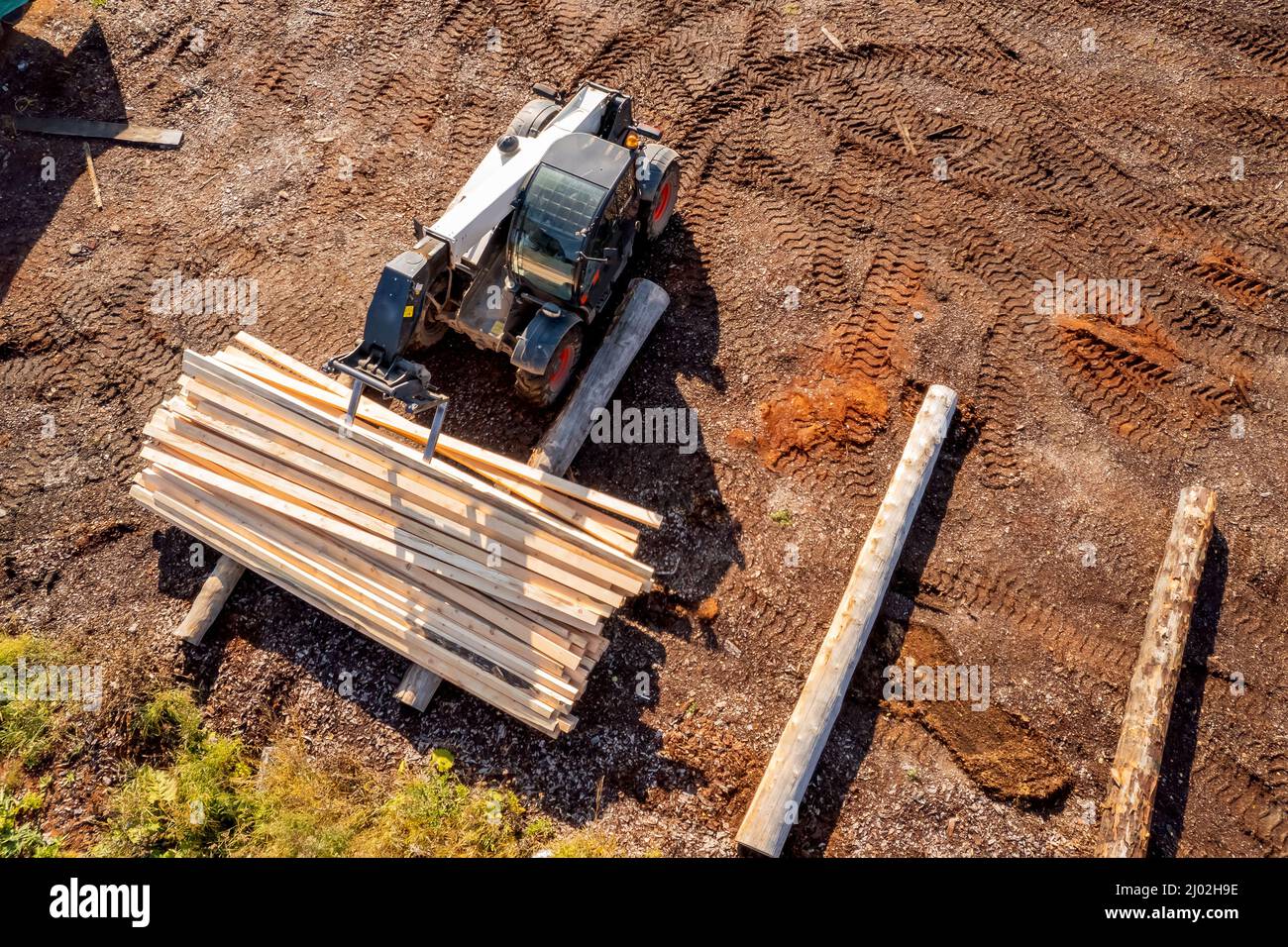Loader works on sawmill, transporting timber and logs for export ...